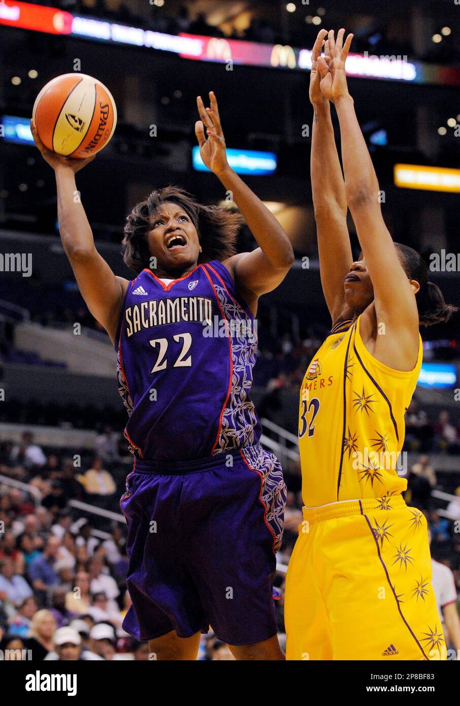 Sacramento Monarchs' DeMya Walker, left, puts up a shot as Los Angeles ...
