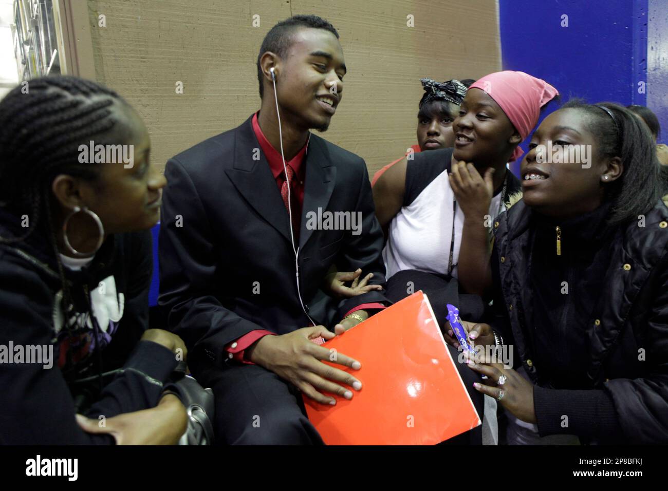 In this photo taken Monday, June 8, 2009, Aaron Sio, center, prepares ...
