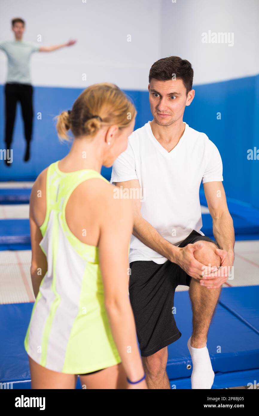 Trampoline coach training woman Stock Photo - Alamy