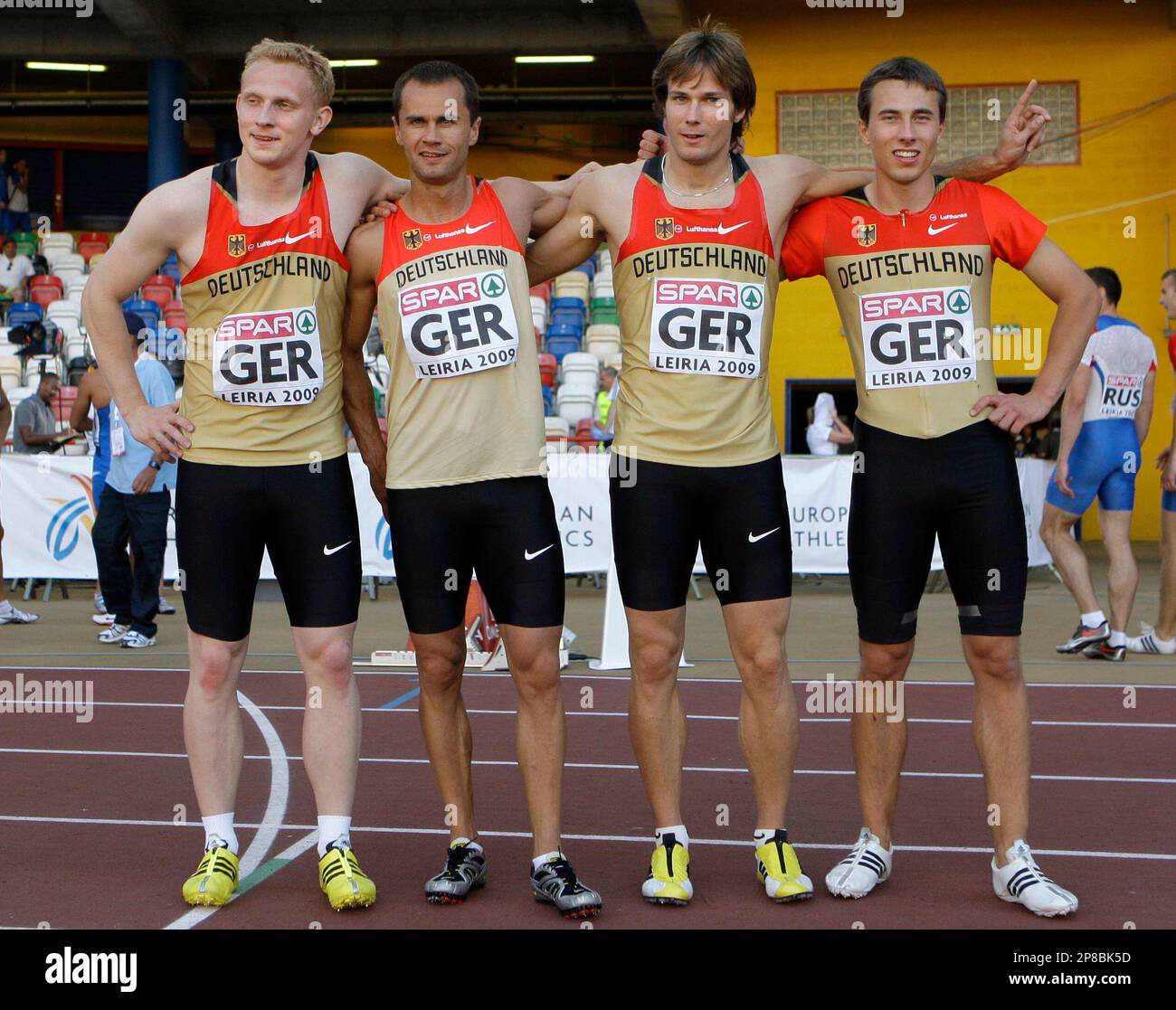Germany's 4 x 100 meters team pose for a photo after finishing second ...