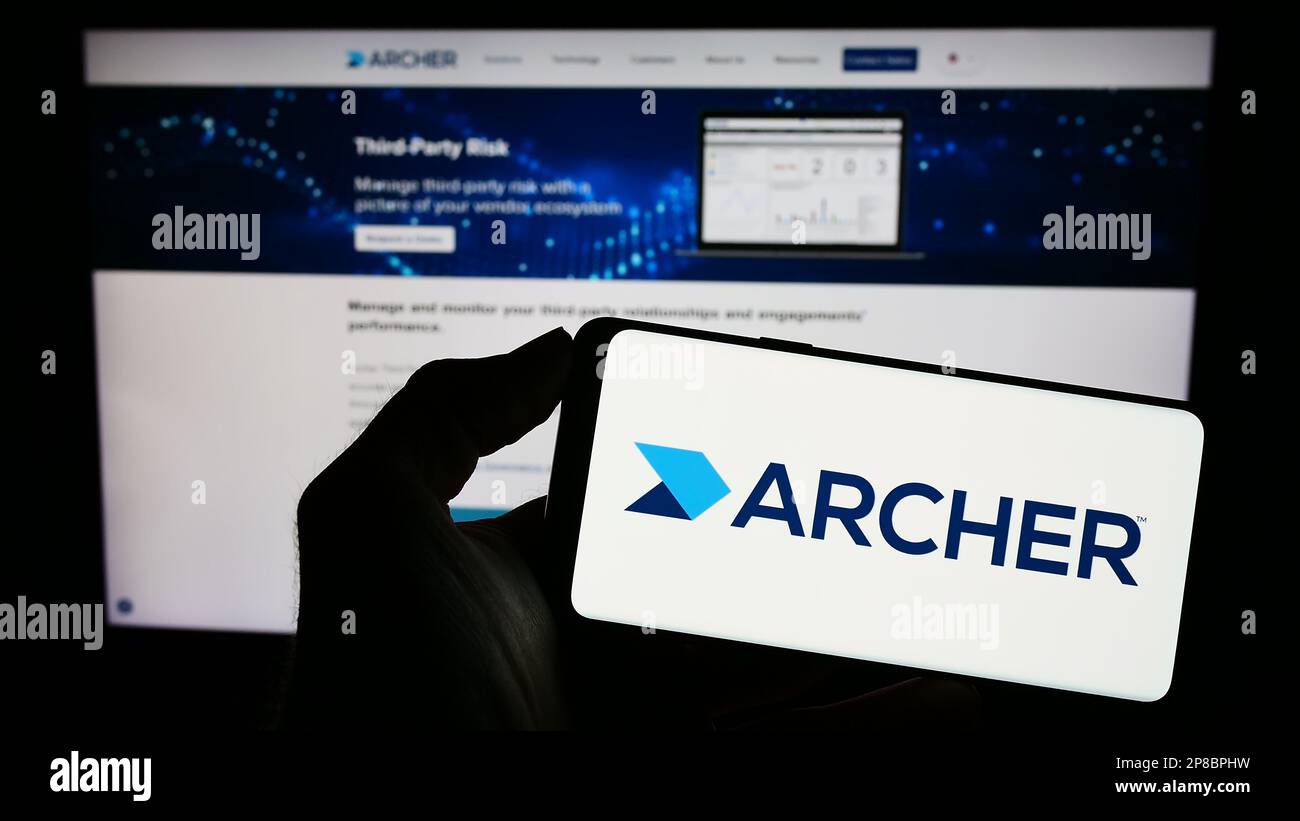 Person holding mobile phone with logo of risk management software Archer (RSA Security) on ...