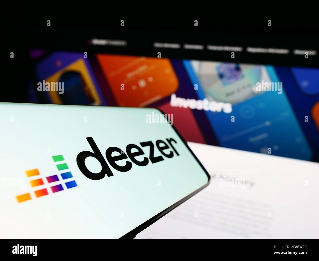 Mobile phone with logo of French music streaming company Deezer S.A. on ...