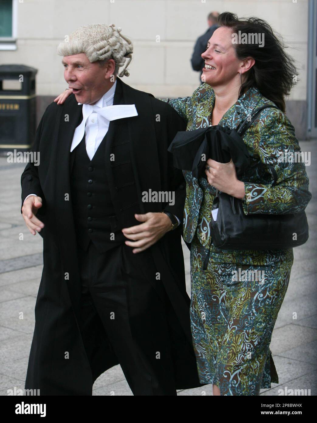 Sunday Tribune journalist Suzanne Breen, right, reacts as she walks ...