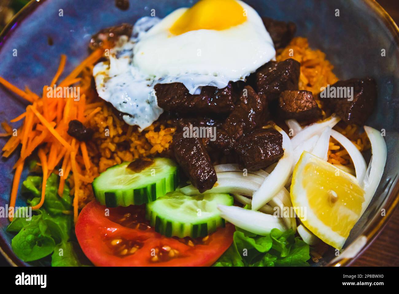 Bibimbap traditional Korean dish of mixed rice with meat, egg and ...