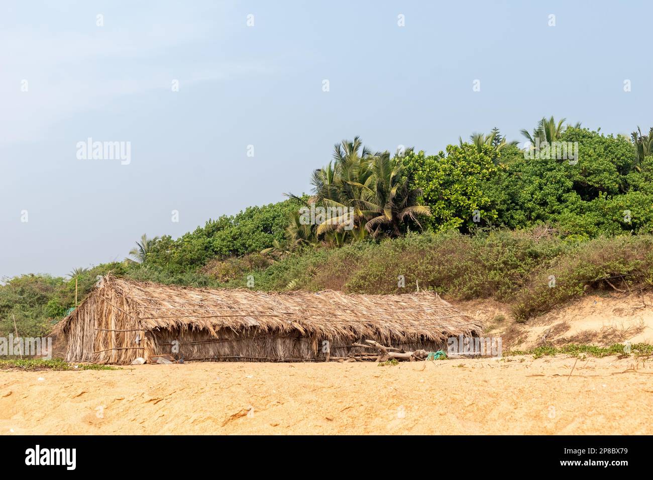 Candolim, Goa, India - January 2023: A rustic straw hut at a quiet ...