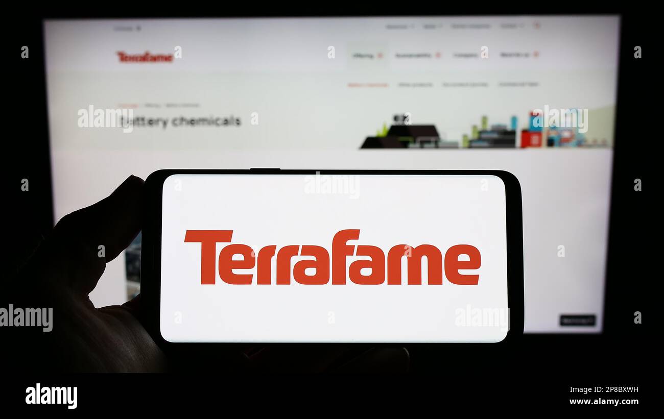 Person holding smartphone with logo of Finnish battery chemicals ...