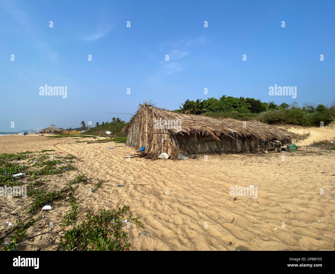 Candolim, Goa, India - January 2023: A rustic straw hut at a quiet ...