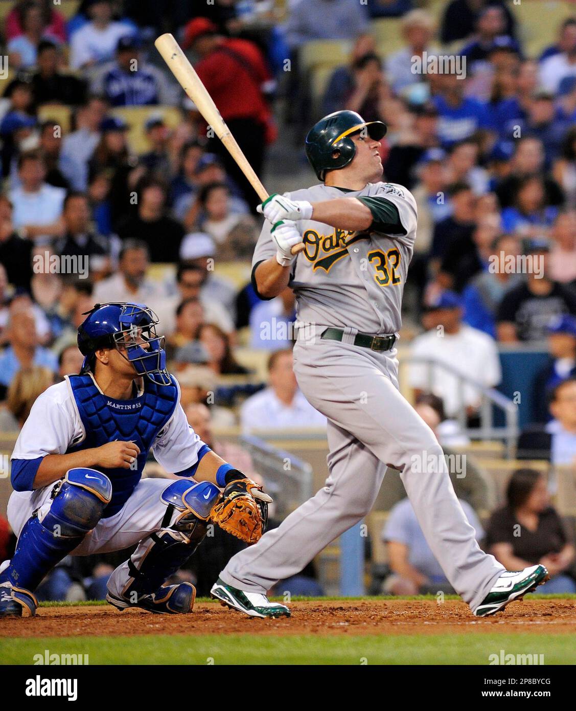 Oakland Athletics' Jack Cust, right, hits a two-run home run as Los ...