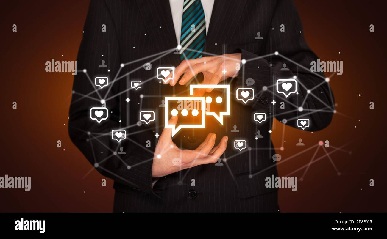 Hand holding social media icons Stock Photo - Alamy