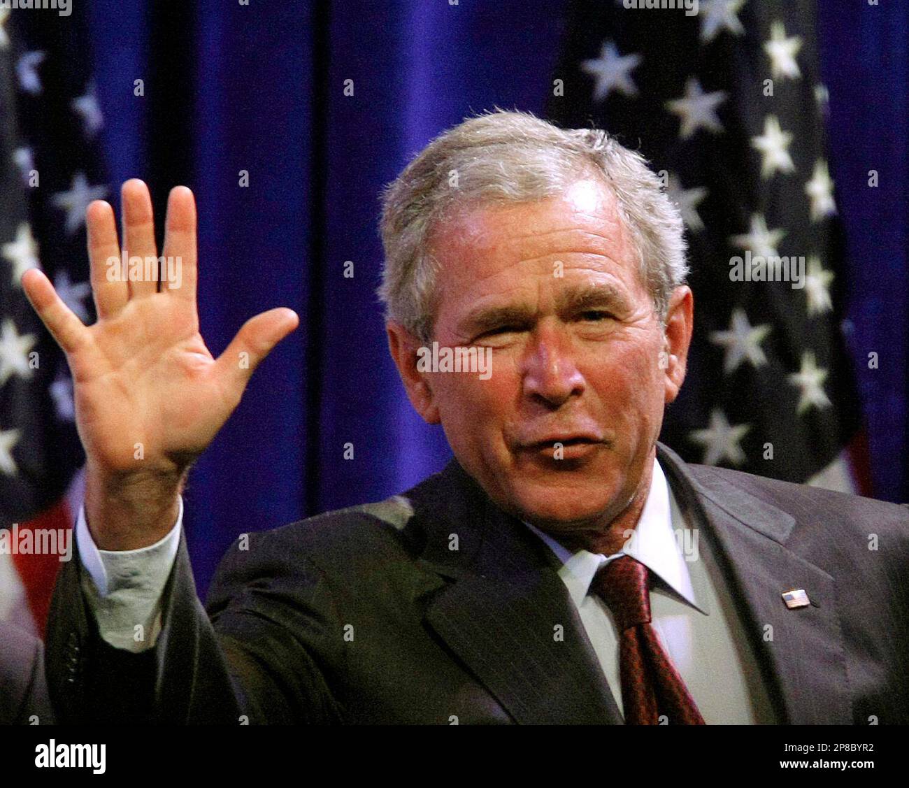 Former President George W. Bush, right, waves as he is introduced to ...