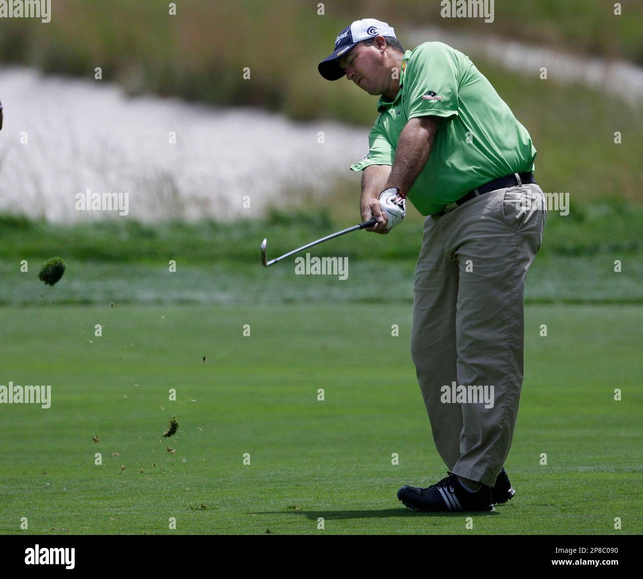 Boo Weekley raises a divot as he hits on the fifth fairway during his ...