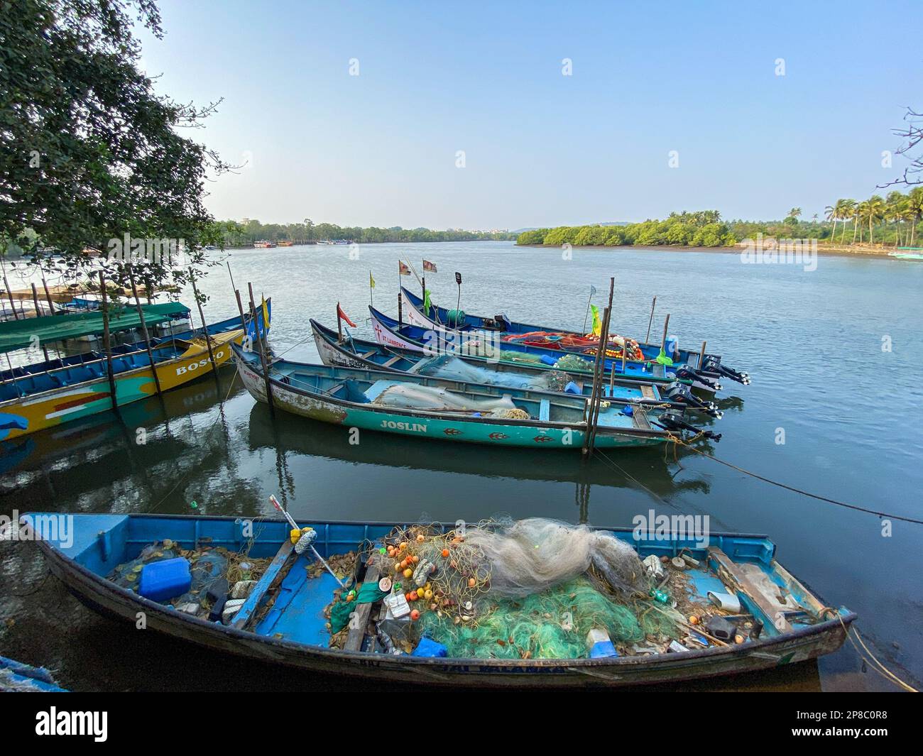 Sinquerim, Goa, India - January 2023: Fishing boats parked on the banks ...