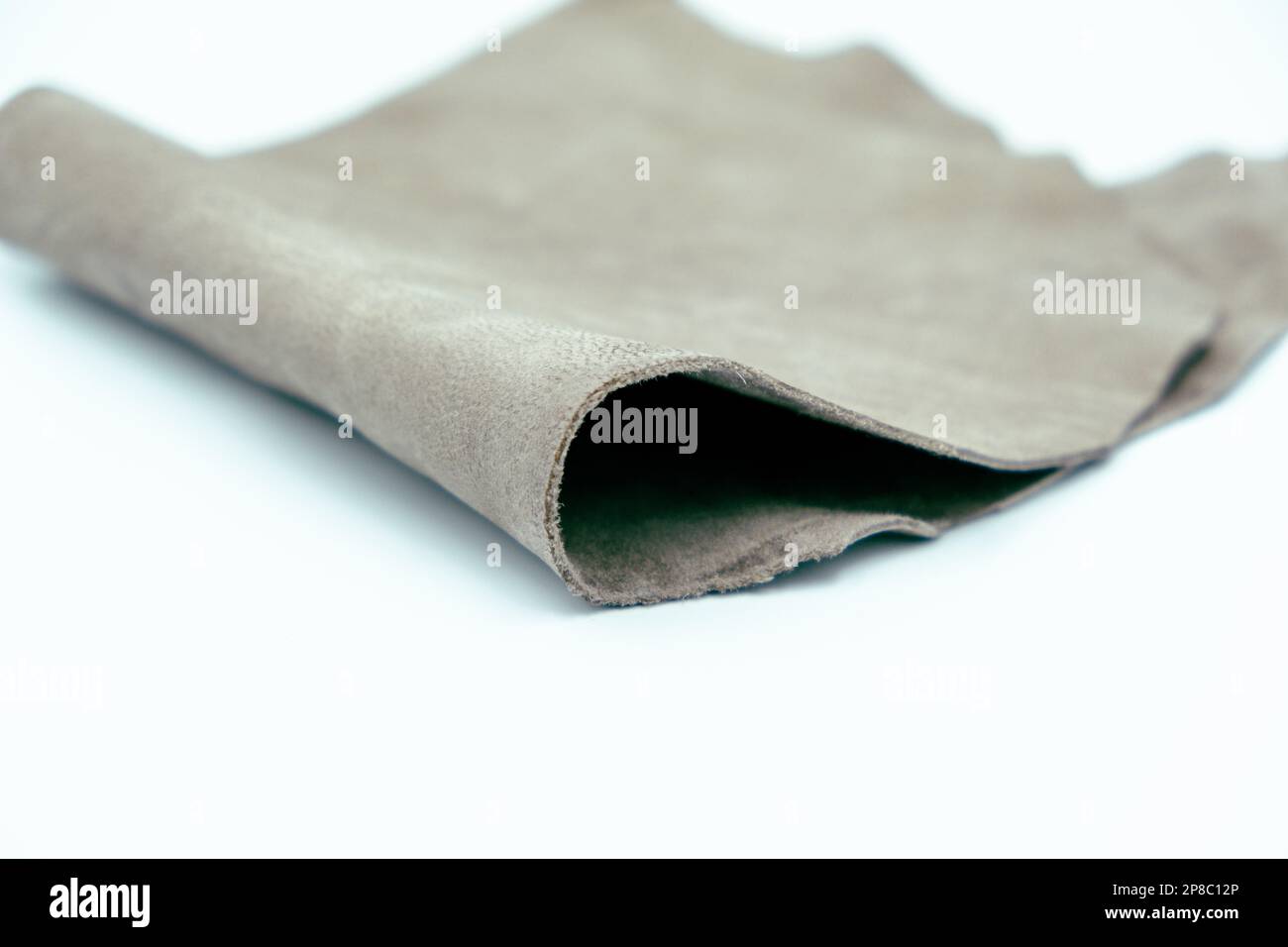 Piece of gray leather and suede cut on white background. Concept and ...