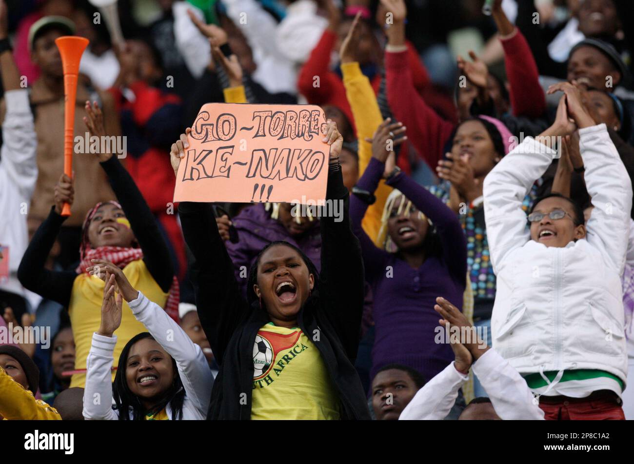 Fans supporting Spain's Fernando Torres hold up a sign reading "Go ...