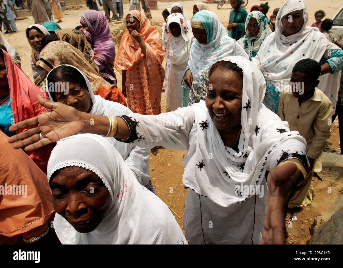 Ethnic Pakistani Sheedi devotees celebrate during crocodile festival at ...