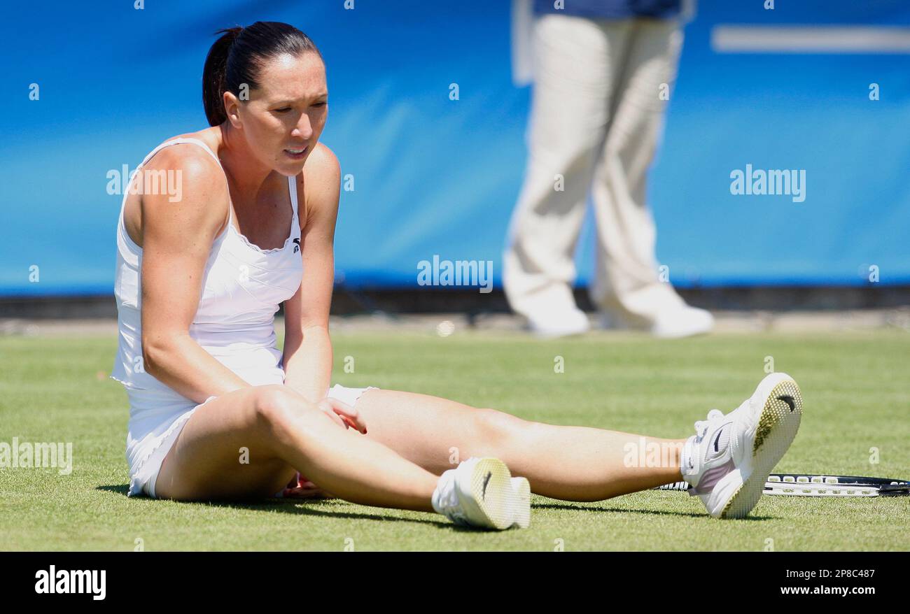Jelena Jankovic of Serbia falls during her Eastbourne grass court ...