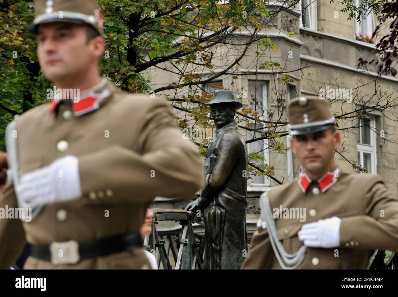 A Hungarian guard of honor march in front of the statue of the 1956 ...