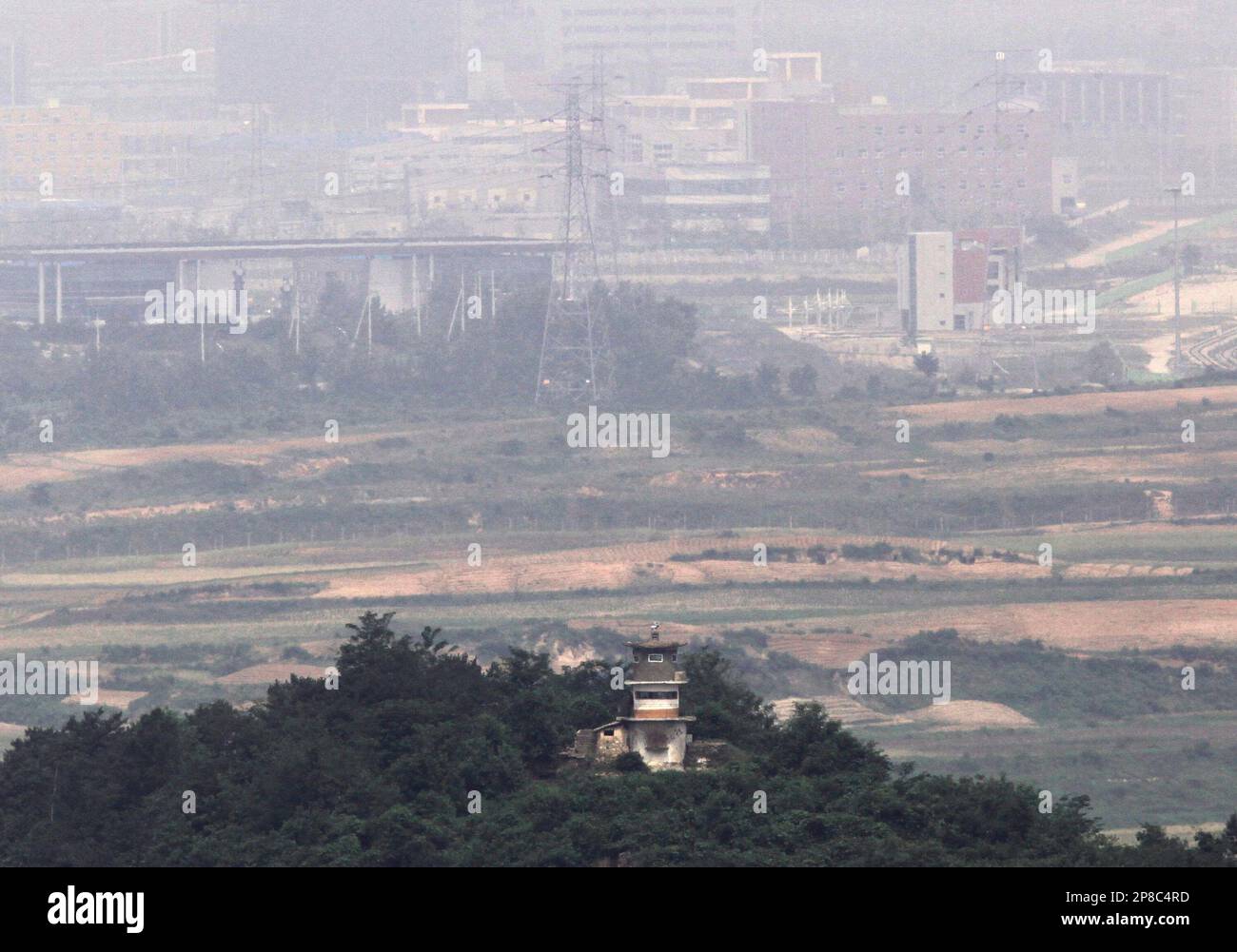 A North Korean soldier, at left on guard post, stands guard at a post ...