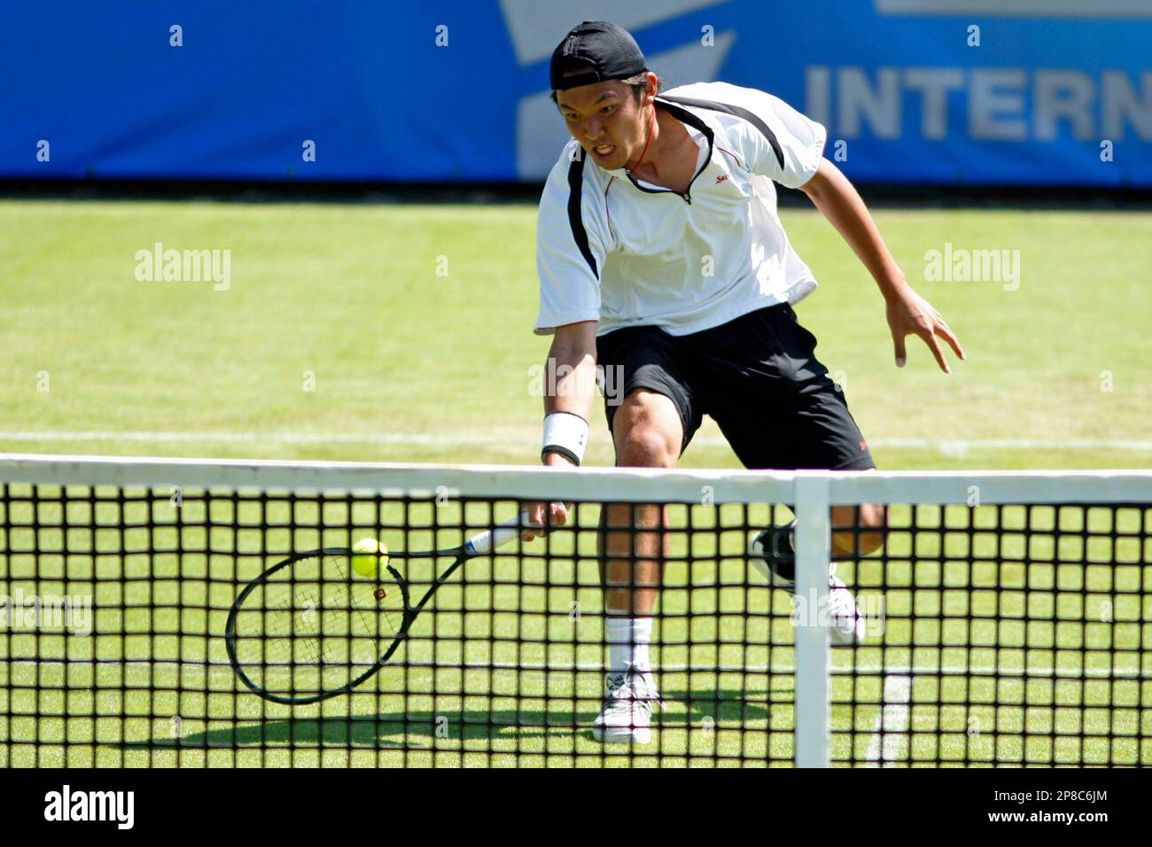 Tatsuma Ito of Japan plays a return to Joshua Goodall of Britain during ...