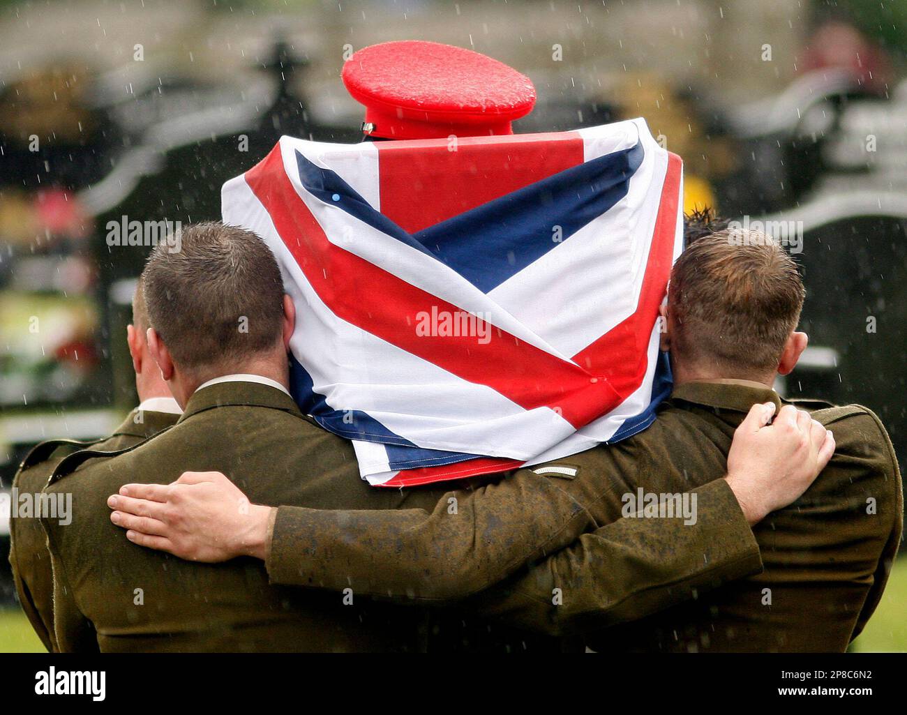 British soldiers from the Light Dragoons carry the coffin of their ...