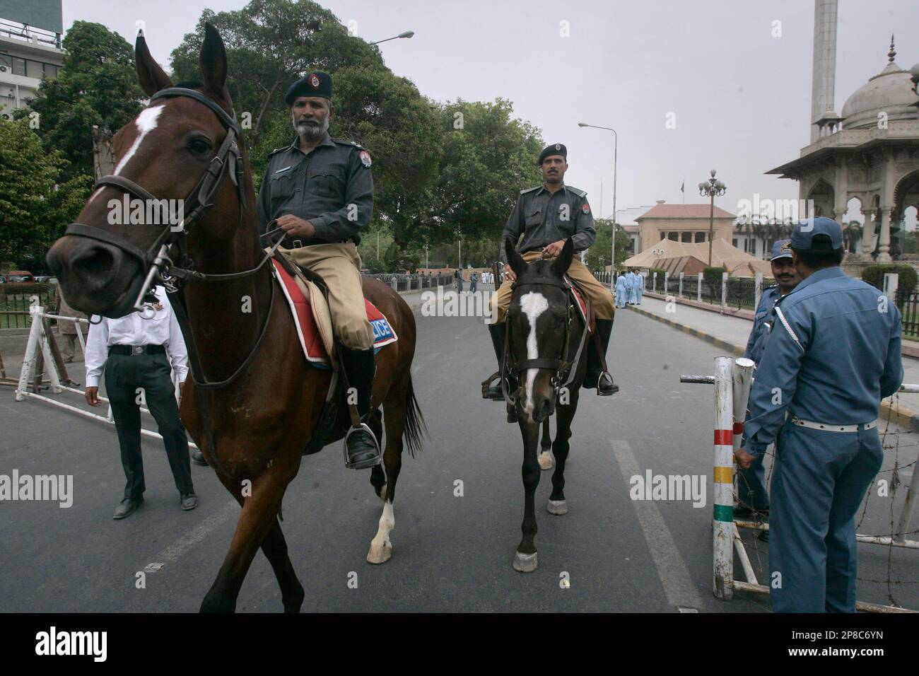Pakistani police officers patrol near the provincial assembly building ...