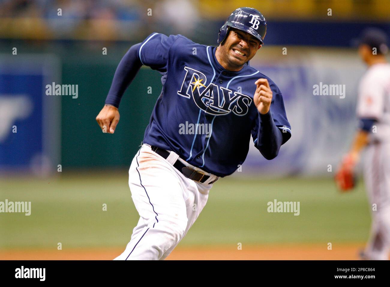 Tampa Bay Rays' Carlos Pena rounds third on his way home to score the ...