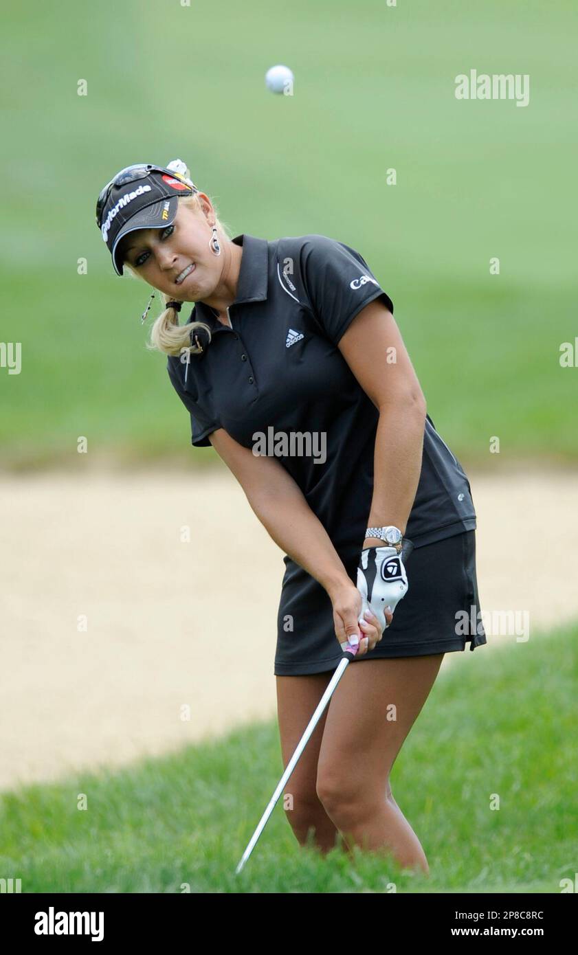 Natalie Gulbis hits from the bunker onto the ninth green during the ...