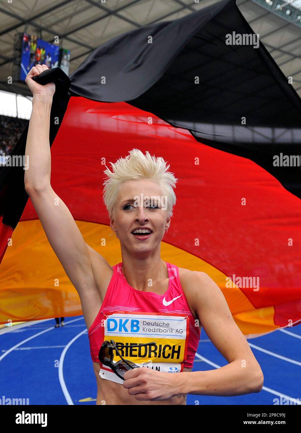ariane-friedrich-of-germany-waves-a-german-flag-after-she-won-the-women