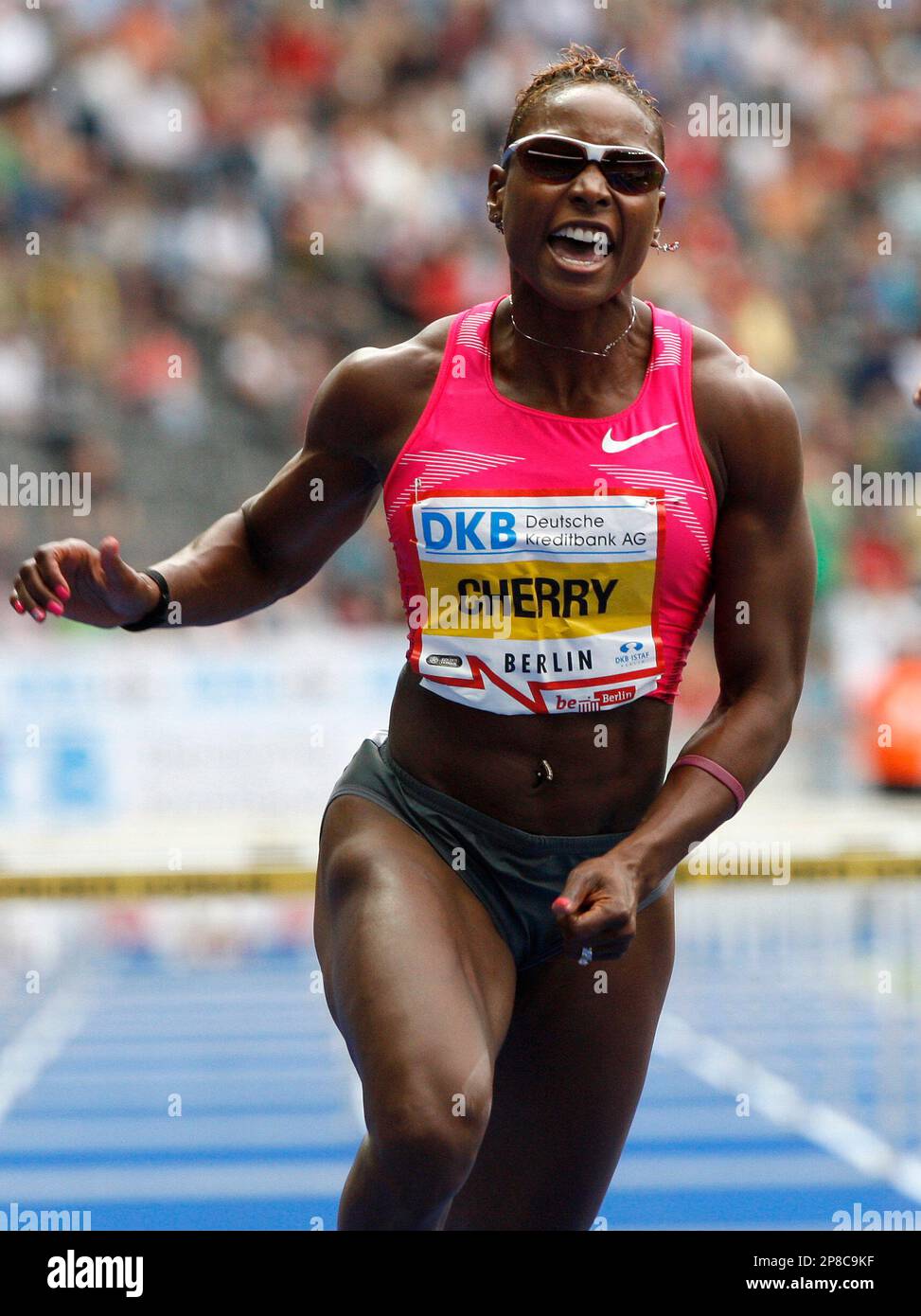 Damu Cherry from the USA finishes first in the women's 100 meters hurdles final of the ISTAF ...