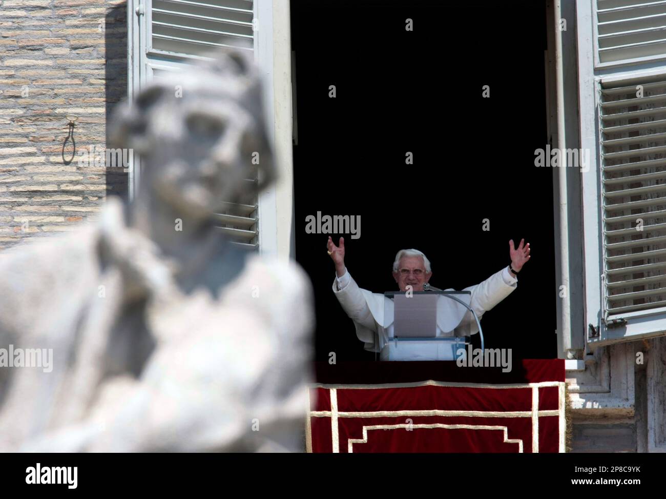Pope Benedict XVI delivers the Angelus noon prayer from the window of ...