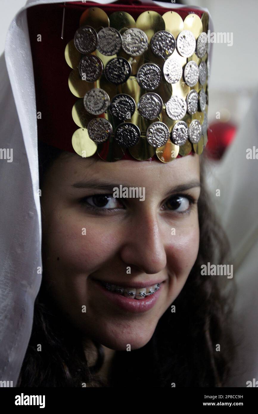 A Palestinian model displays a traditional Palestinian customs during a ...
