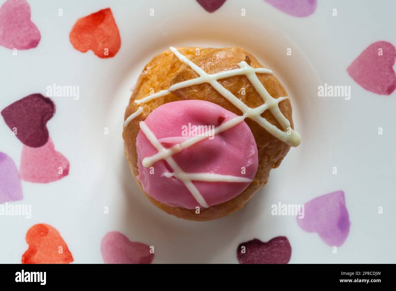 One topped with raspberry fondant hi-res stock photography and images ...