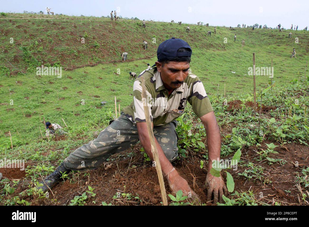 An Indian Army soldier plants a tree at the Shreegram Reserve Forest in ...