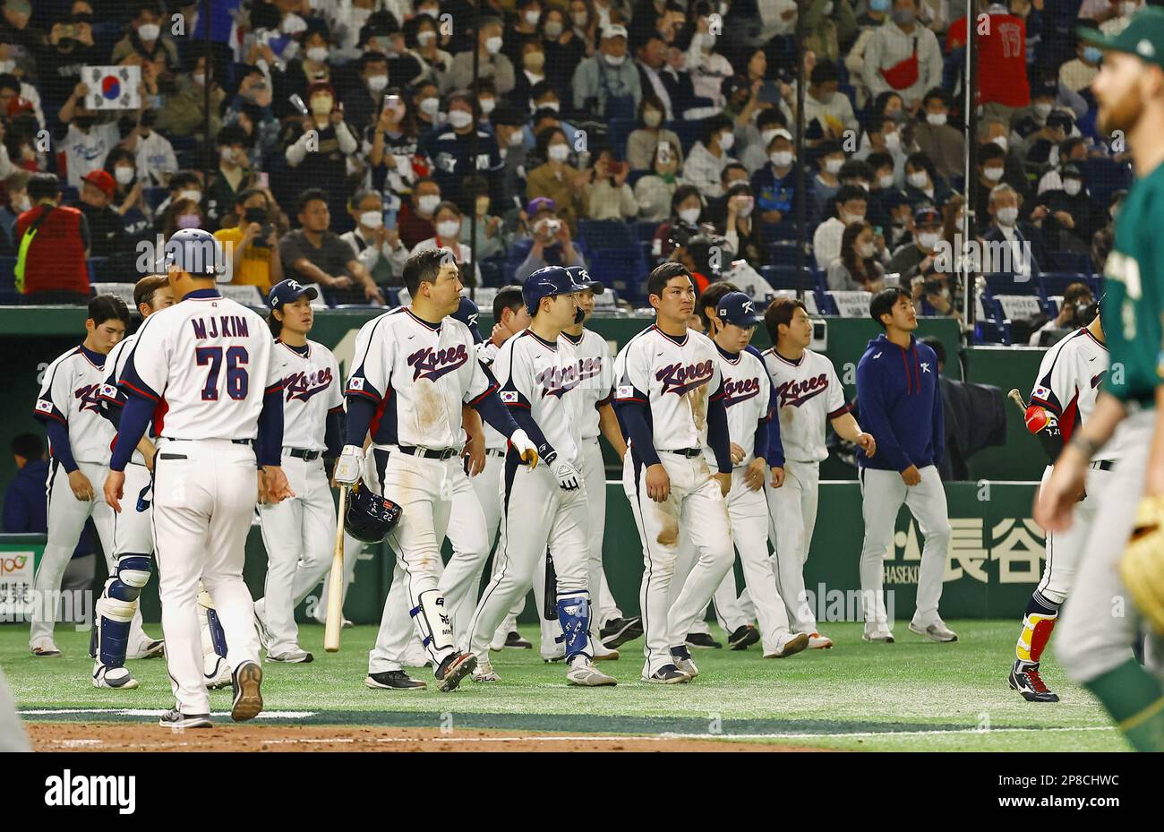 South Korean national baseball team members appear dejected after being ...