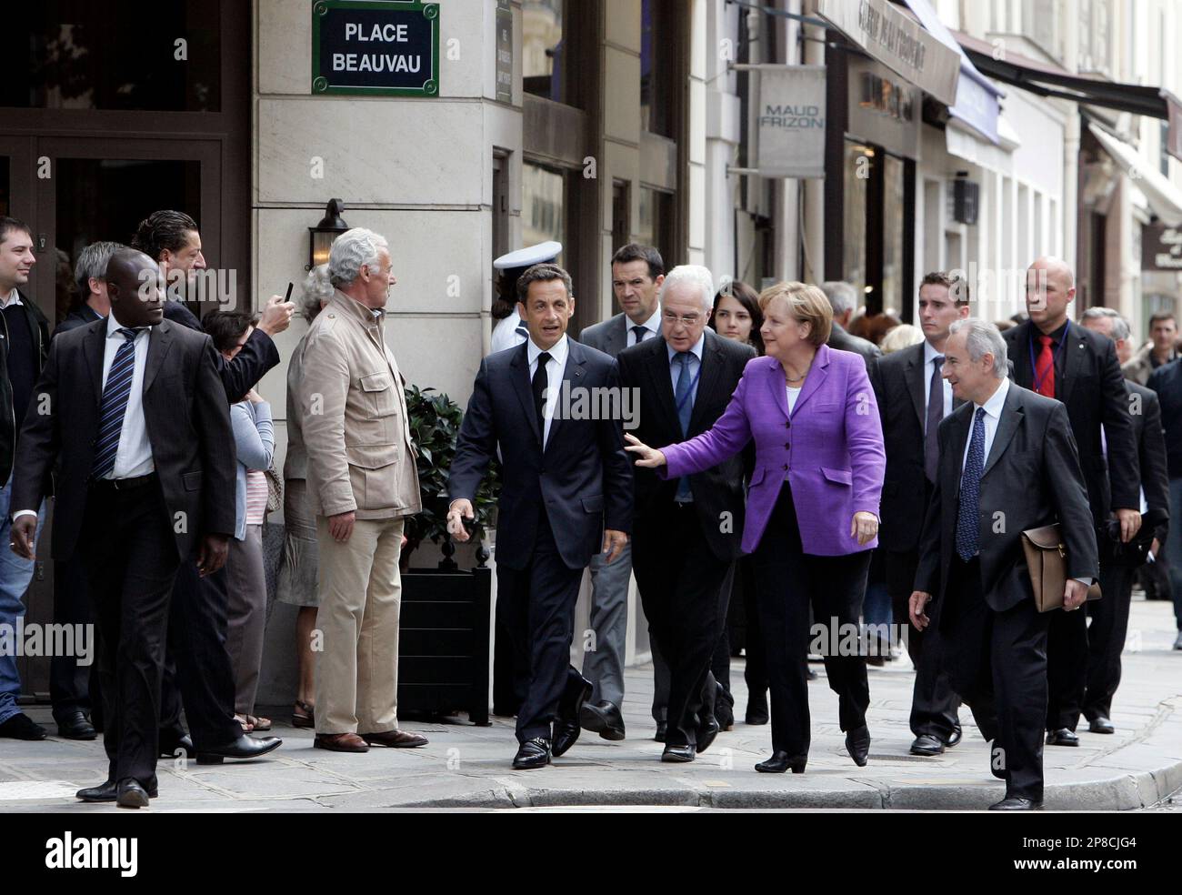 French President Nicolas Sarkozy, left and German Chancellor Angela ...