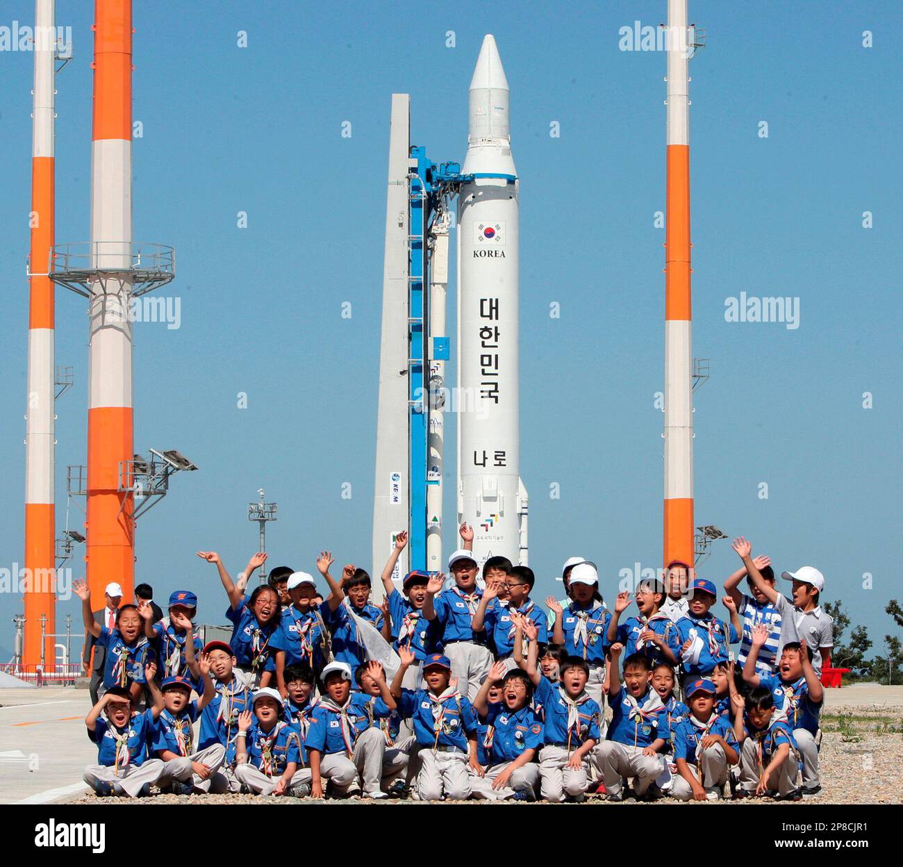 South Korean children cheer in front of the Korea Space Launch Vehicle ...