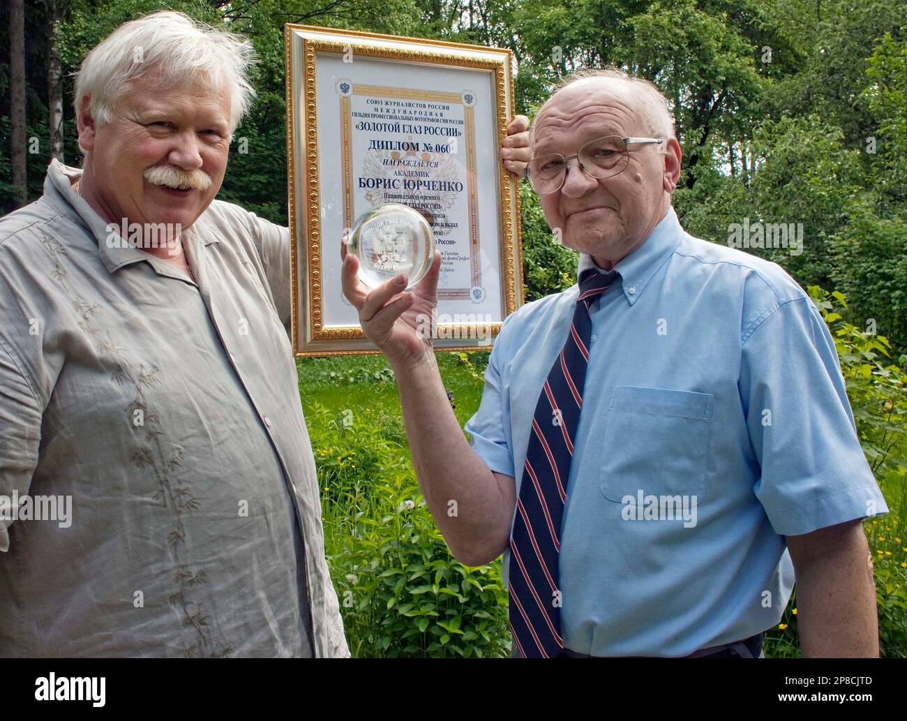 Former Associated Press photographer Boris Yurchenko, holds the Golden ...