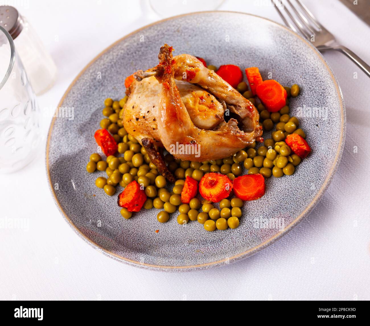 Popular Spanish dish is baked quail Stock Photo - Alamy