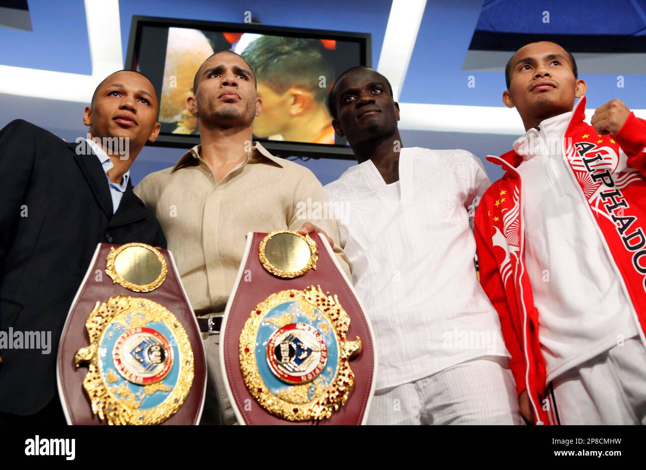 Boxers Ivan Calderon of Puerto Rico, left, Miguel Cotto of Puerto Rico ...
