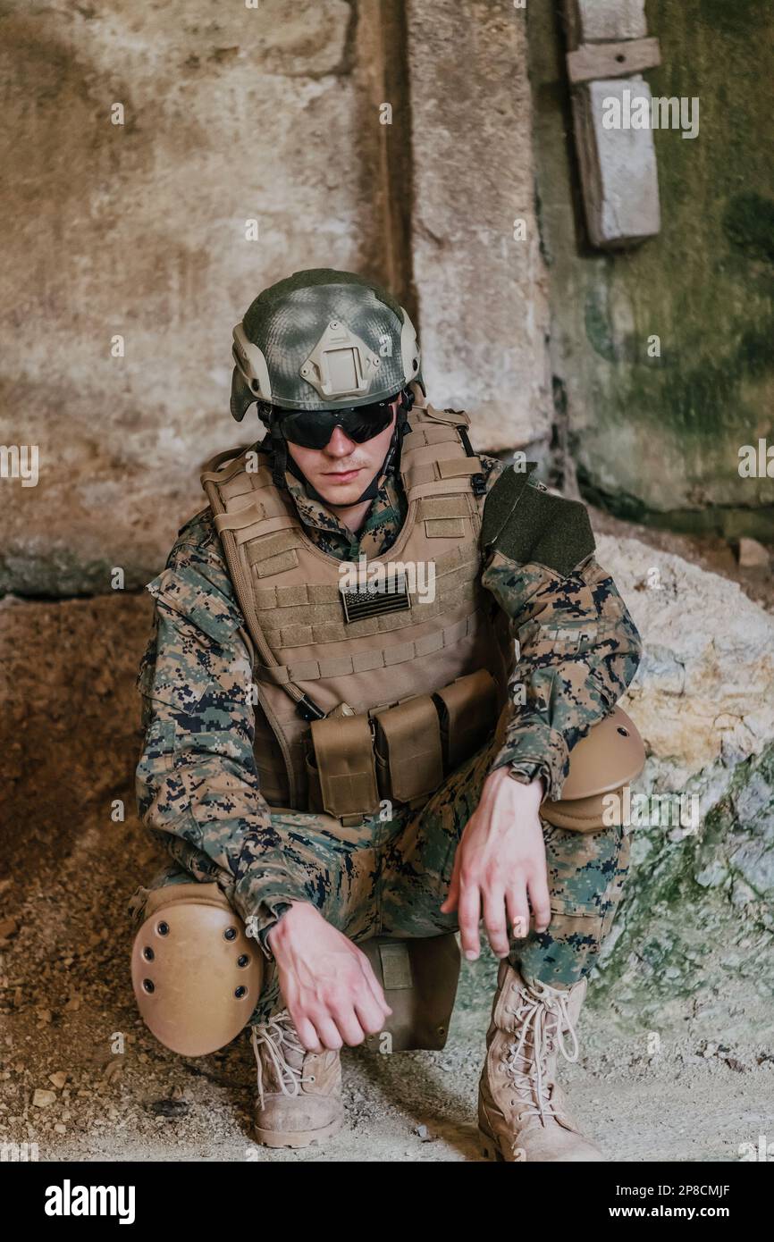 Upset soldier has psychological problems holding his head Stock Photo ...