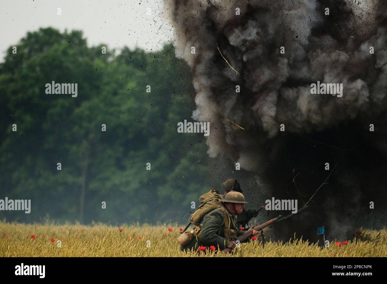 A pyrotechnic charge explodes during filming of an reenactment of the ...