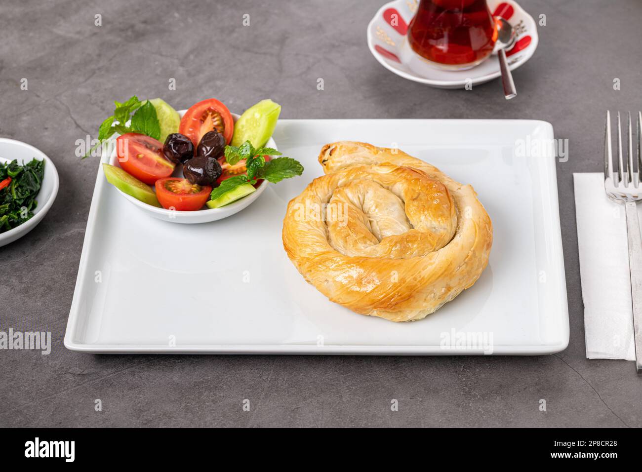 Traditional Turkish pastry made with spinach and cheese wrapped in ...