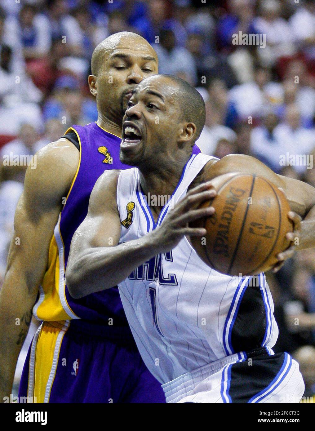 Orlando Magic's Rafer Alston (1) drives past Los Angeles Lakers' Derek ...