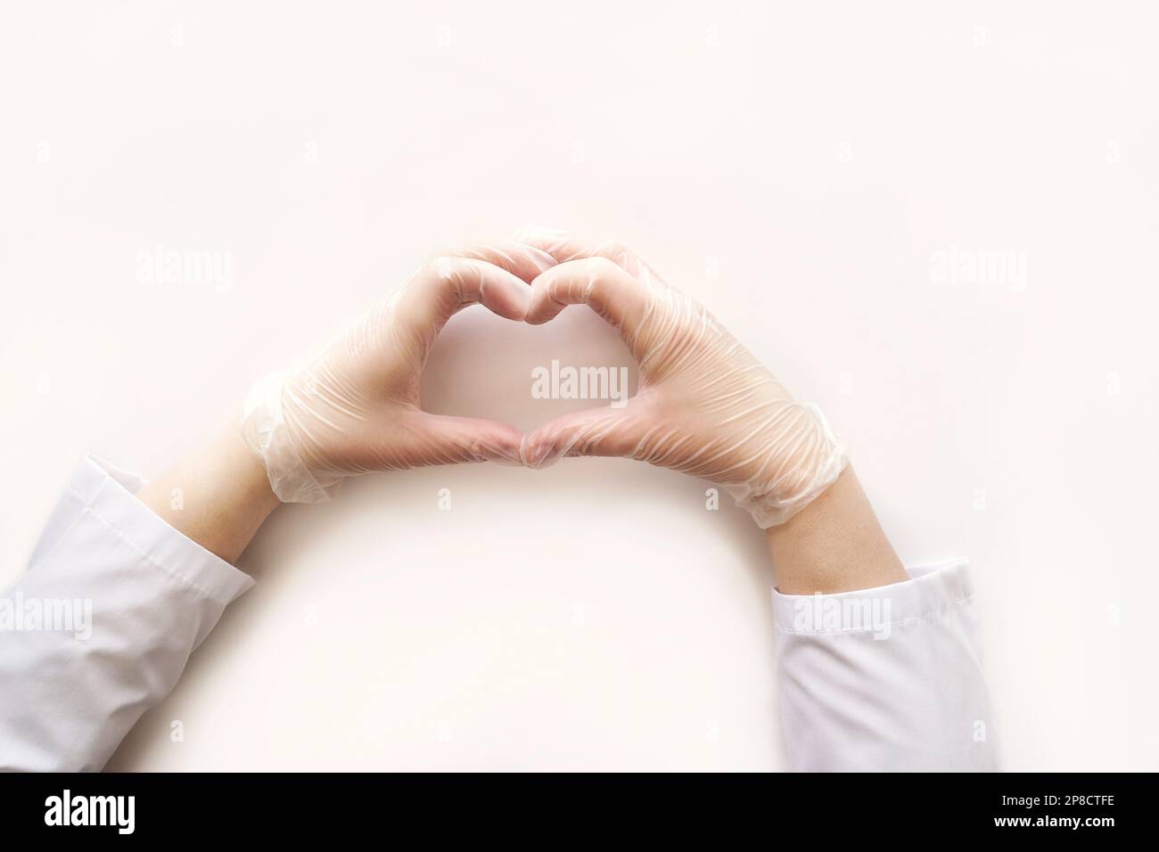Heart in Medical glove. Surgery doctor hand. Medicine healthcare ...