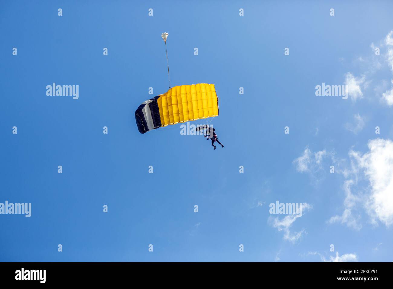 view of parachute descending with two people Stock Photo - Alamy