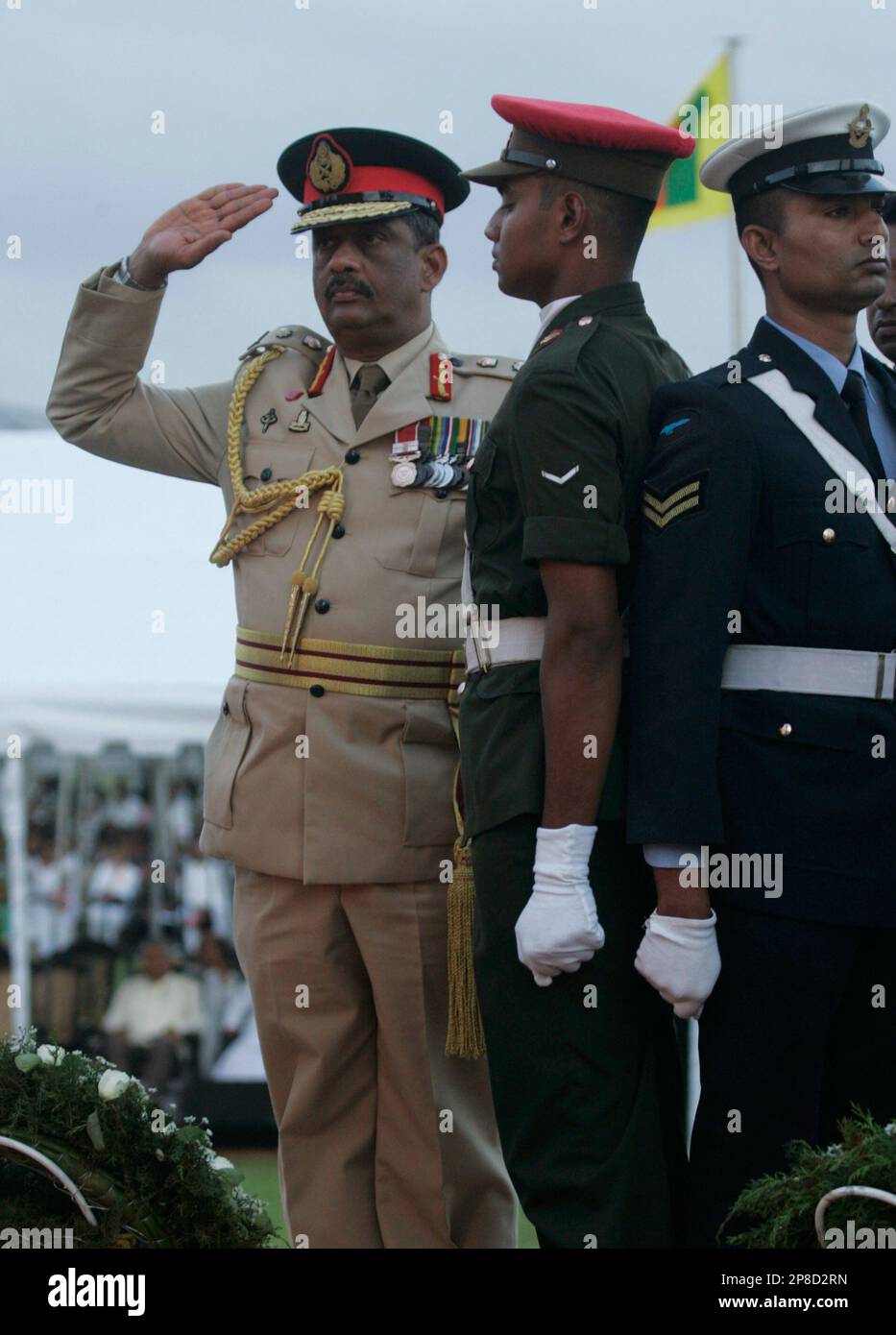 Sri Lankan Army commander Gen. Sarath Fonseka, left, salutes the fallen ...