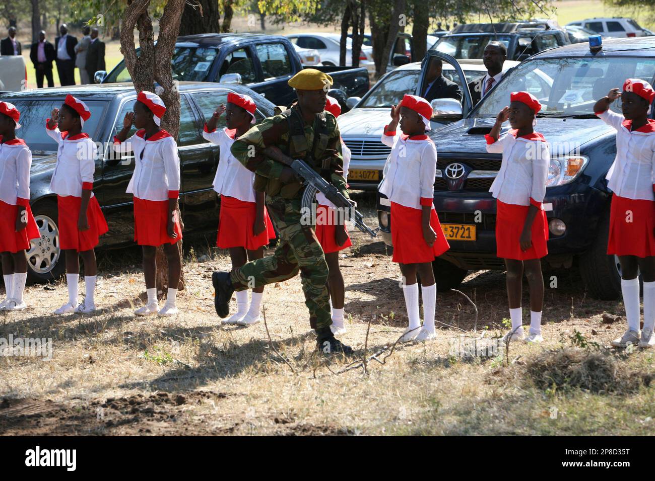 A Zimbabwean soldier runs to take his position upon the arrival of ...