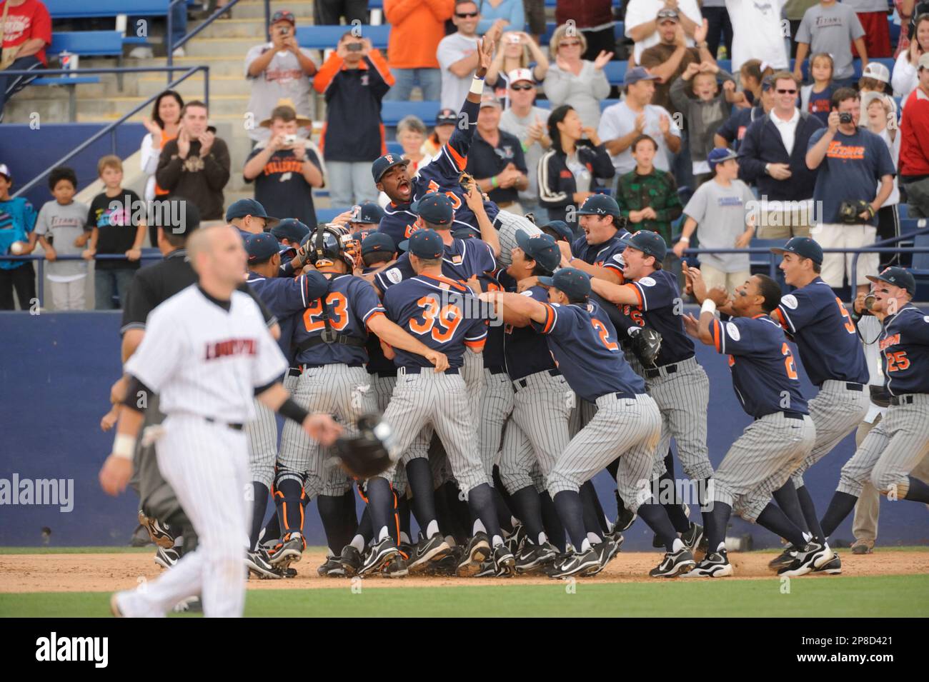 Louisville's Kyle Cheesebrough walks back to the dugout as Cal State ...