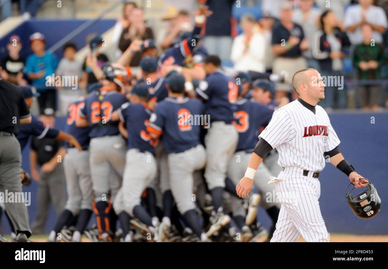 Louisville's Kyle Cheesebrough walks back to the dugout as Cal State ...
