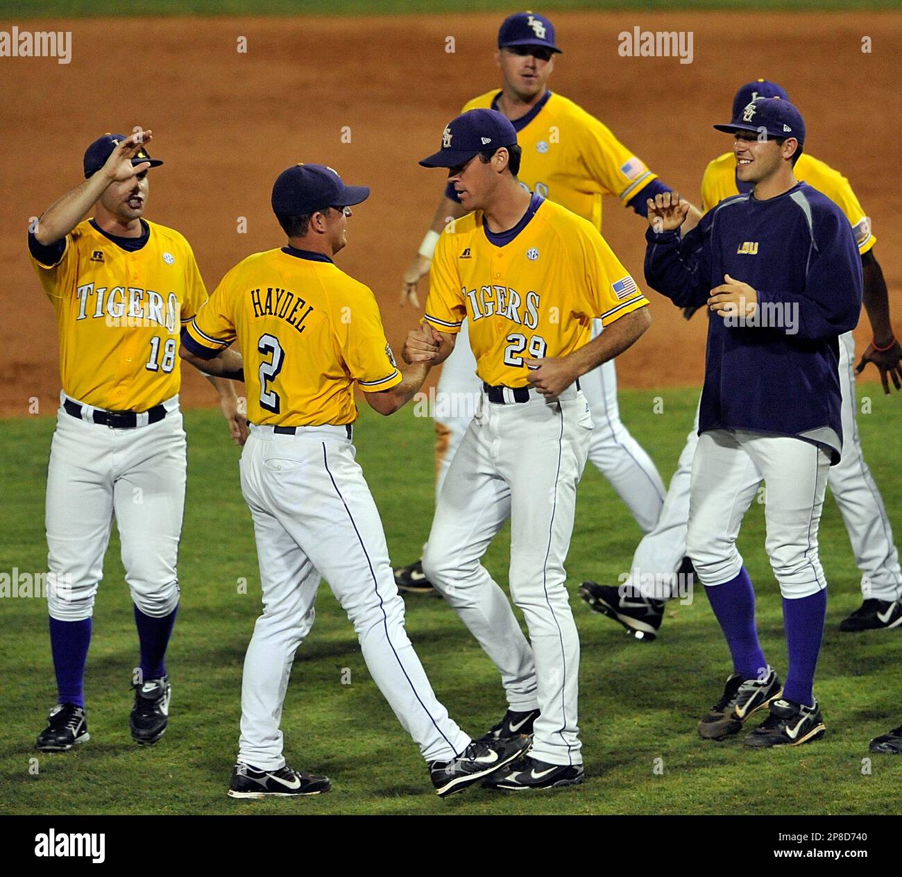Louisiana State closing pitcher Buzzy Haydel (2) is congratulated by ...